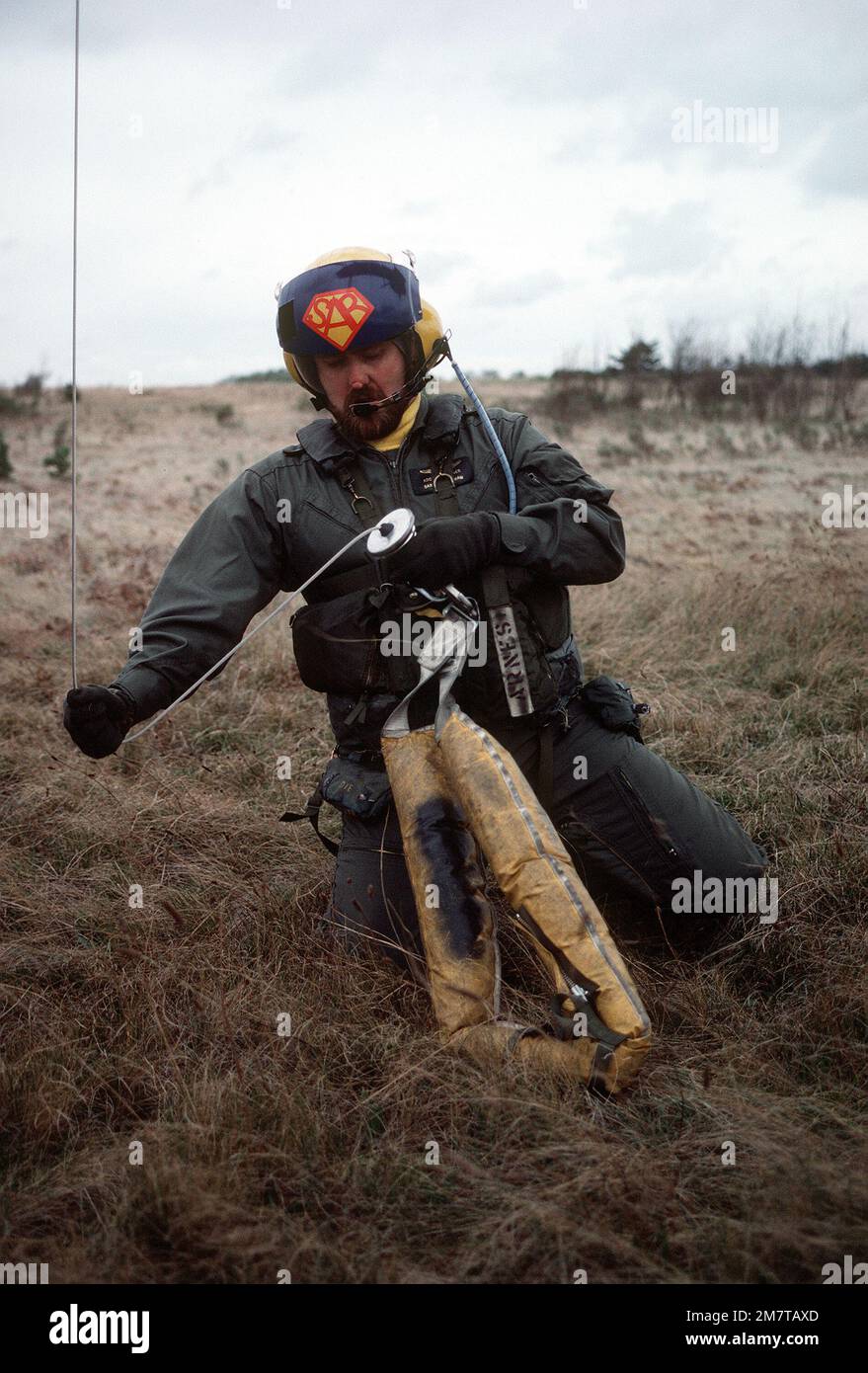 CHIEF Aviation Machinist's Mate (ADC) Dan Arnes regulates the line on a ...