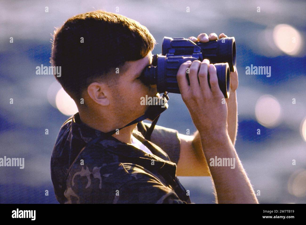 A U. S. Marine aboard the amphibious transport dock USS AUSTIN (LPD-4 ...
