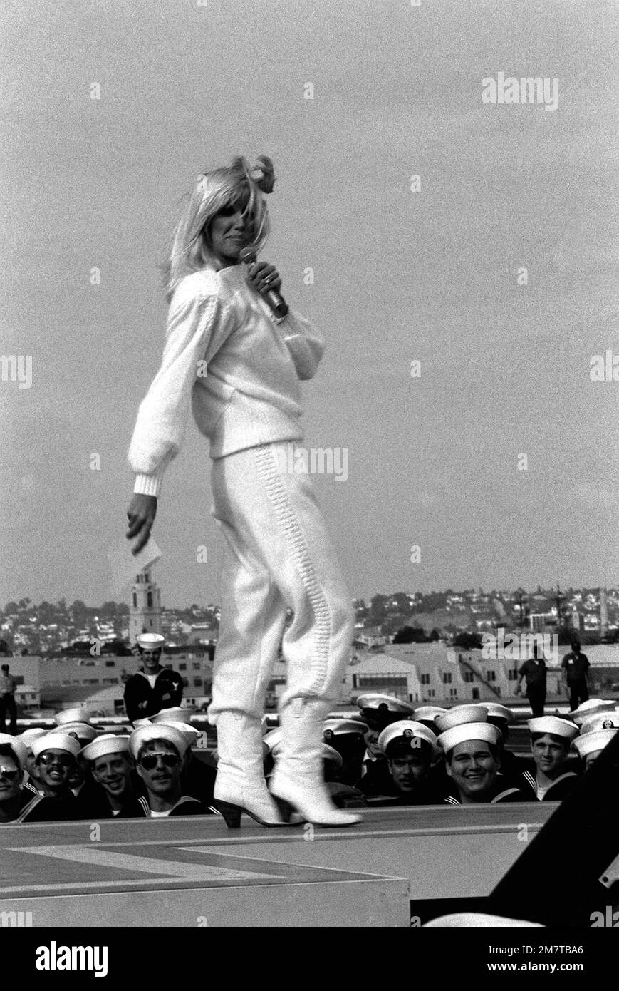 Suzanne Somers performs the crew aboard the aircraft carrier USS RANGER ...