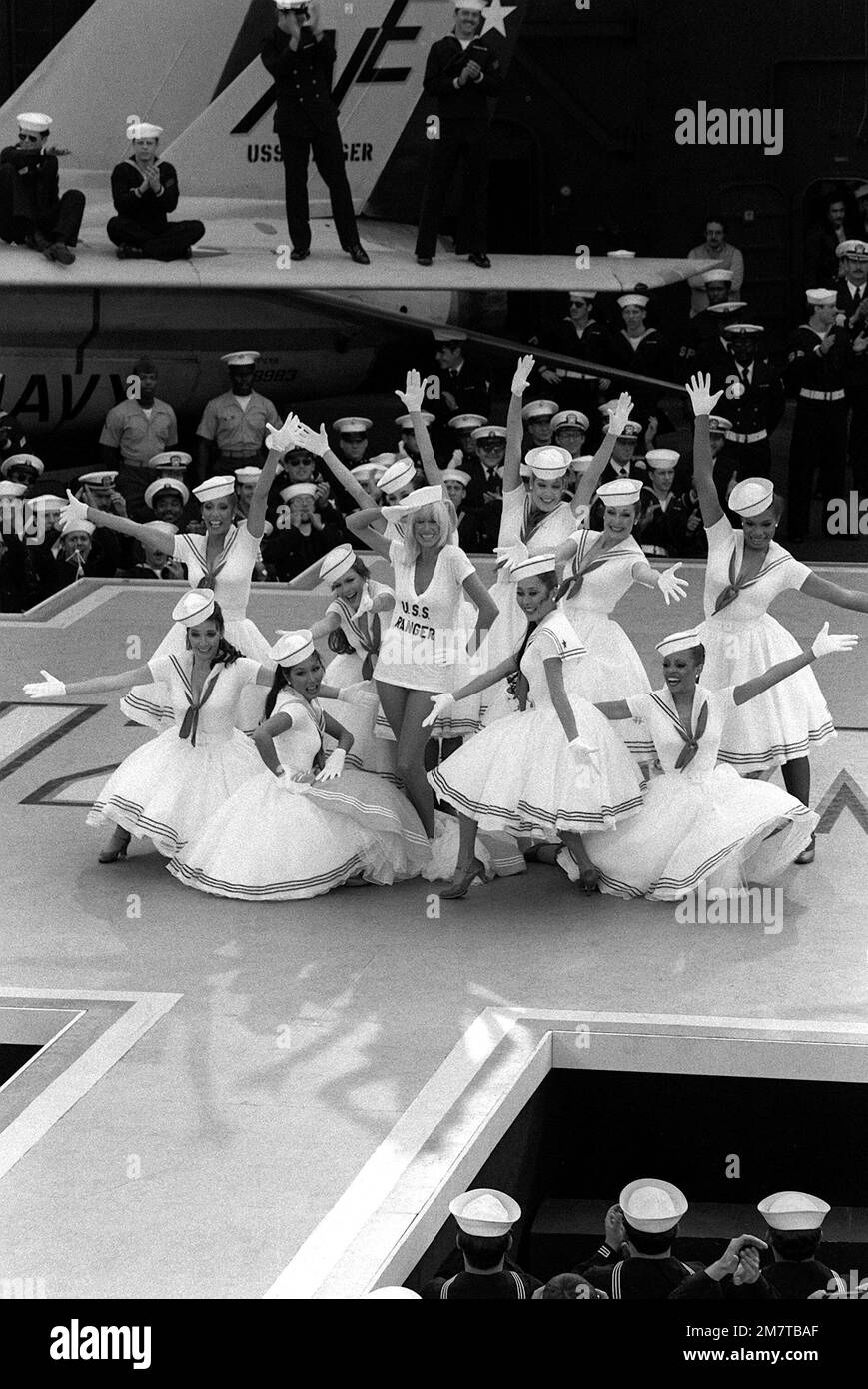 Suzanne Somers, wearing a USS Ranger shirt, performs for the crew of ...