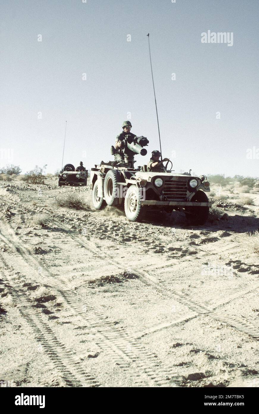 Two combat-ready Marines are in an M-51 jeep with a heavy anti-tank ...