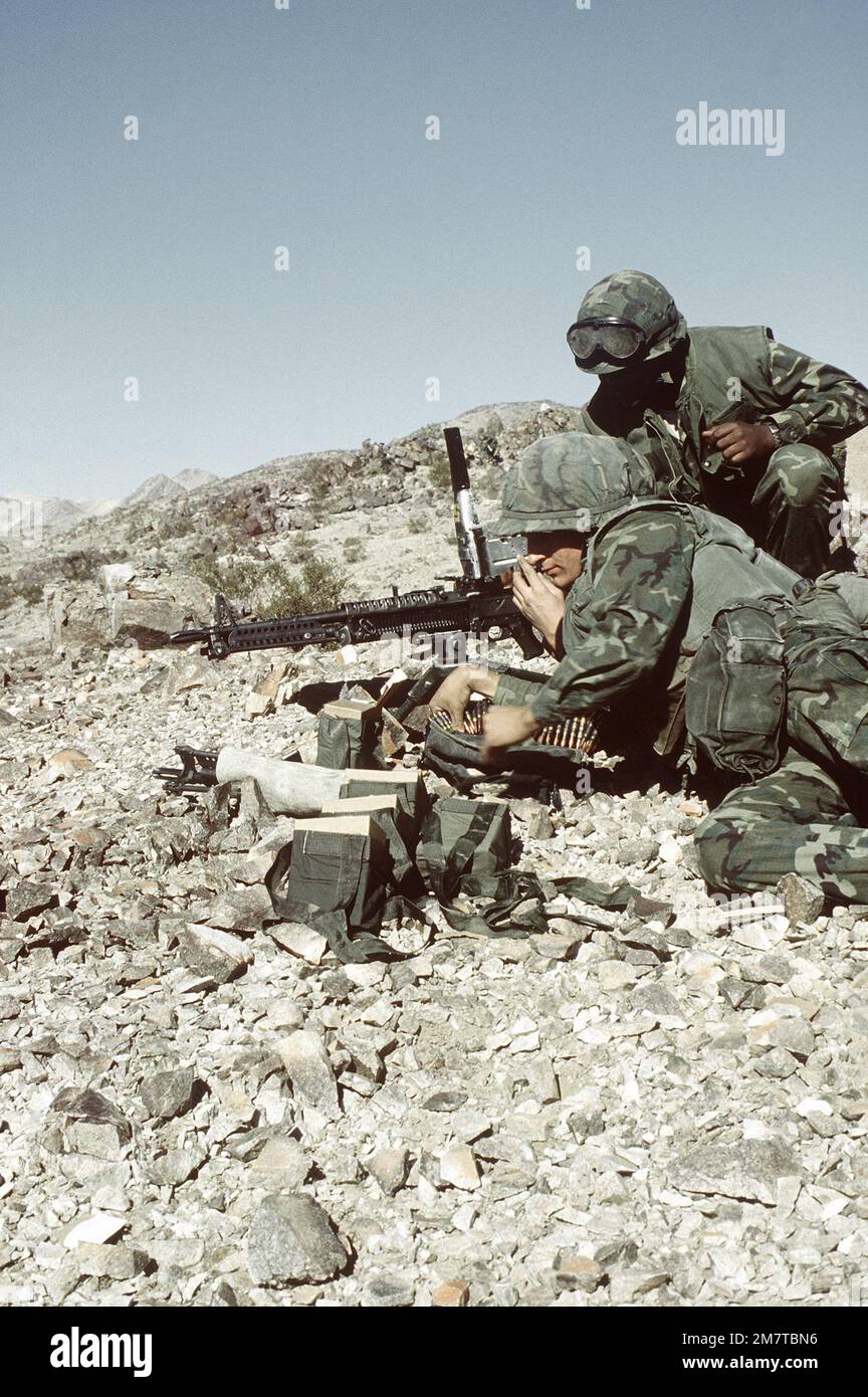 Three combat-ready Marines prepare an M-60A1 machine gun for firing on ...