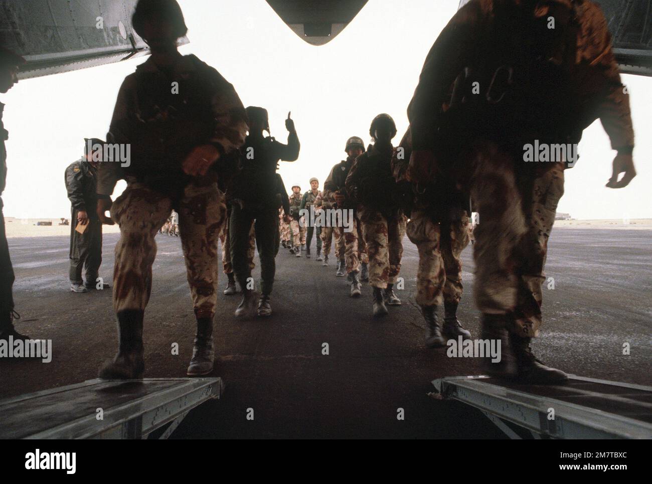 A front view of Egyptian and U.S. troops as they board a C-141 ...