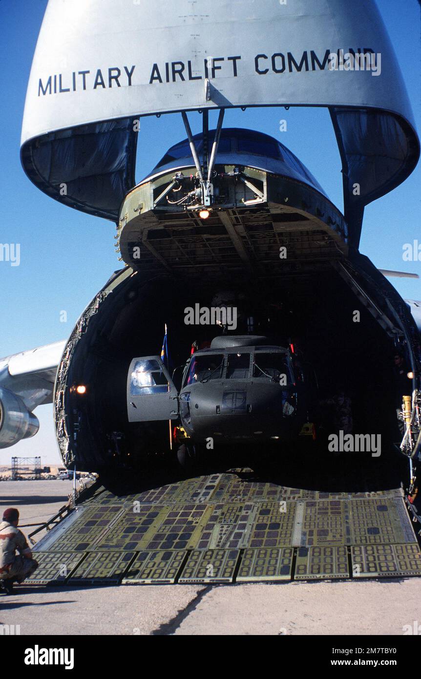 Front view of a CH-3 Jolly Green Giant helicopter being unloaded from a ...