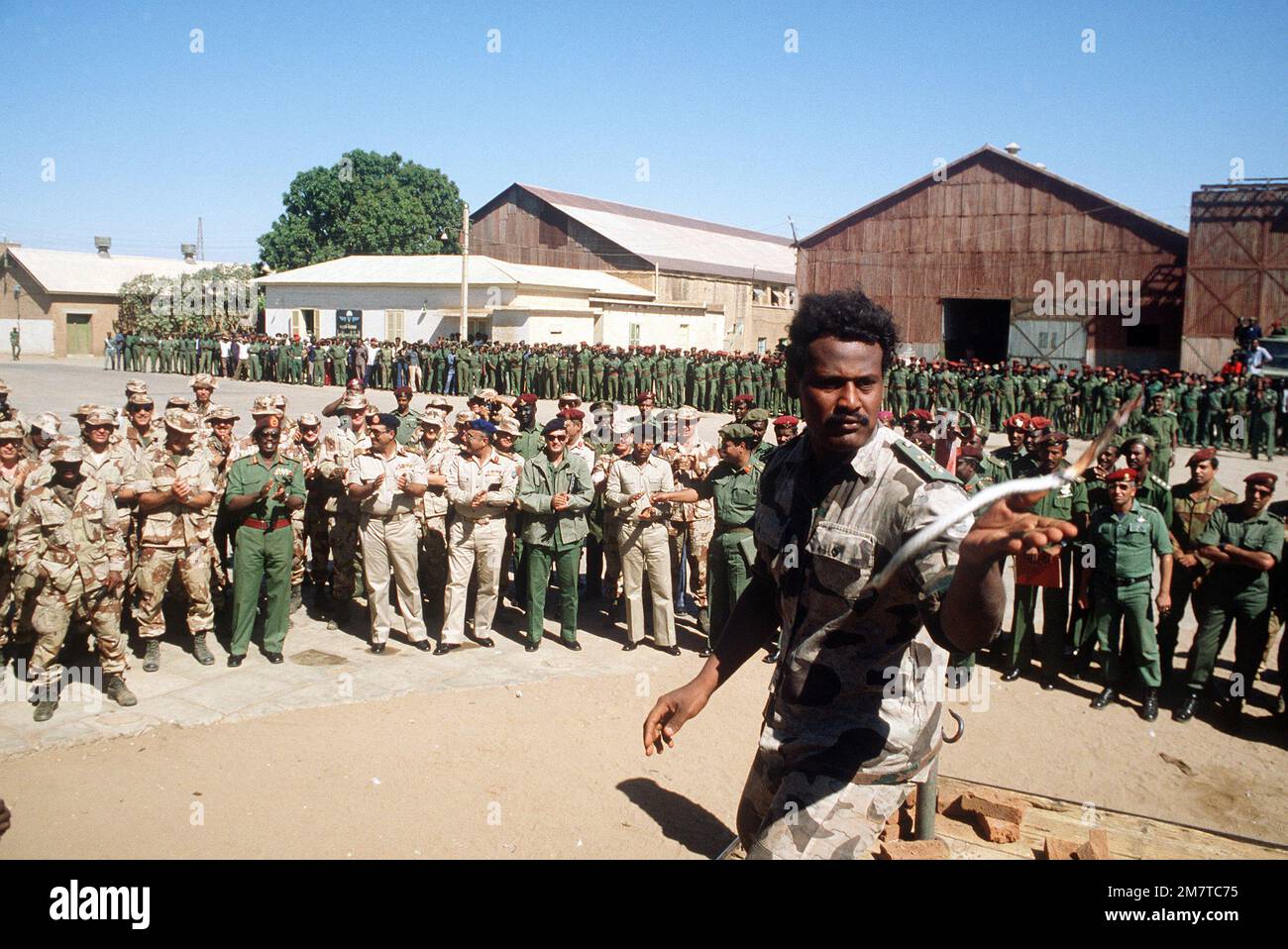 A Sudanese soldier demonstrates the military physical fitness program ...