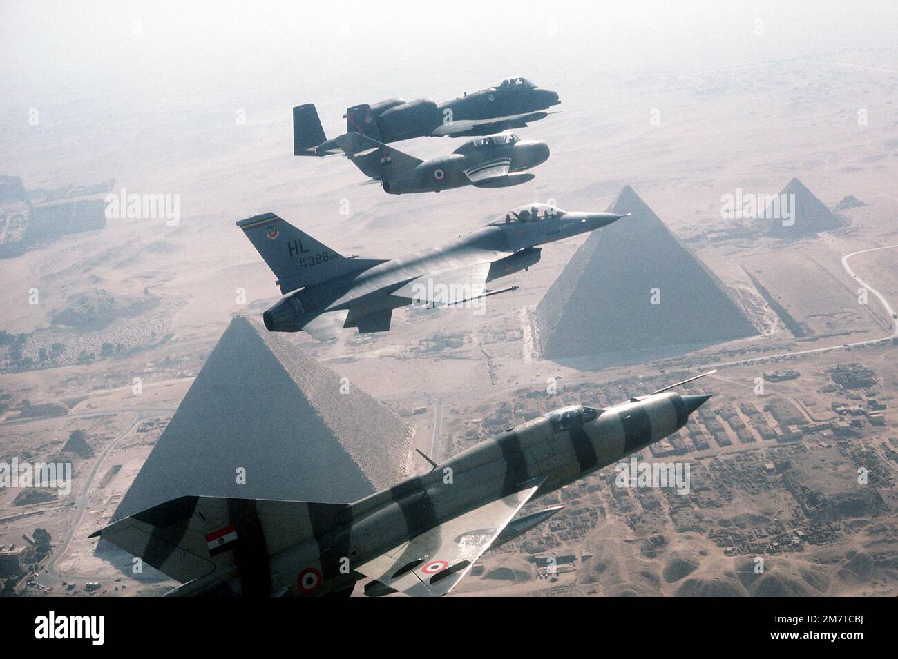 A right side view of aircraft in flight over the pyramids during ...