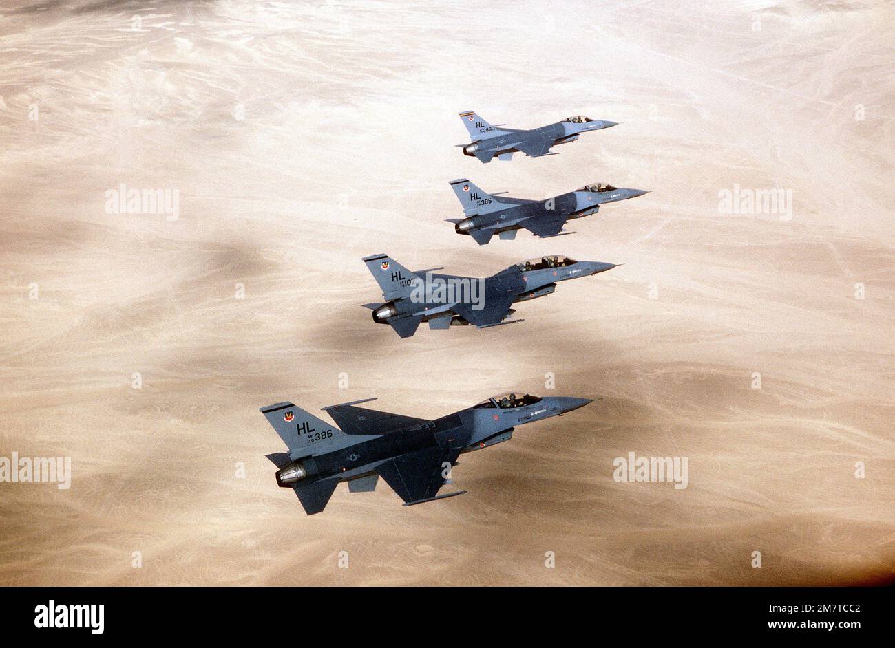 A right side view of a formation of four F-16 Fighting Falcon aircraft ...