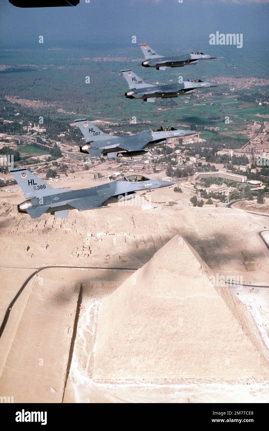 A right side view of a formation of four F-16 Fighting Falcon aircraft ...