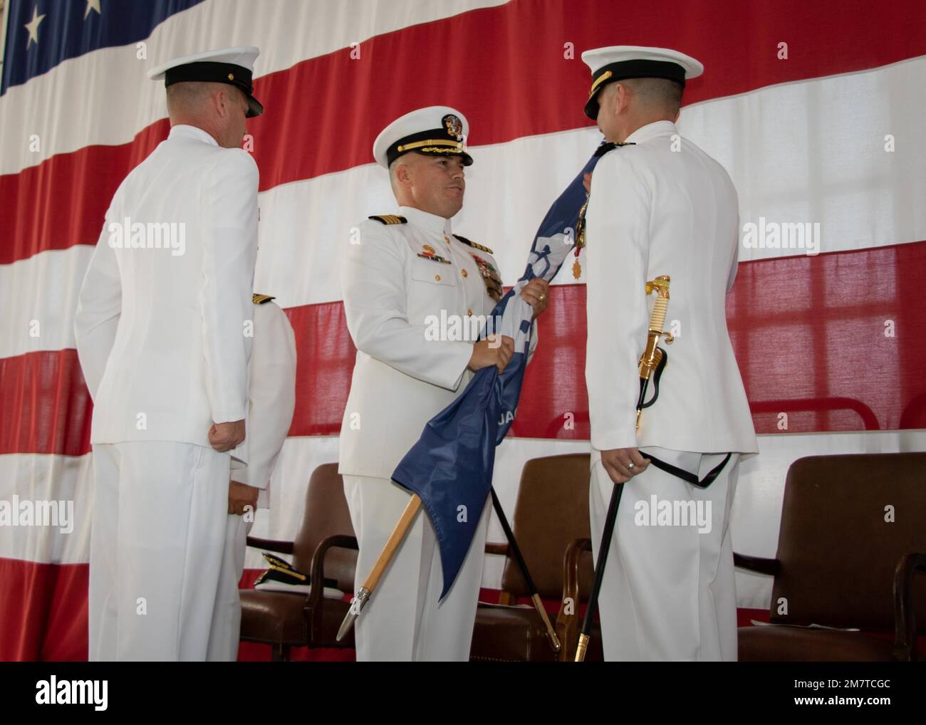 Capt. Jorge Cuadros (right) presents the Naval Facilities Engineering ...