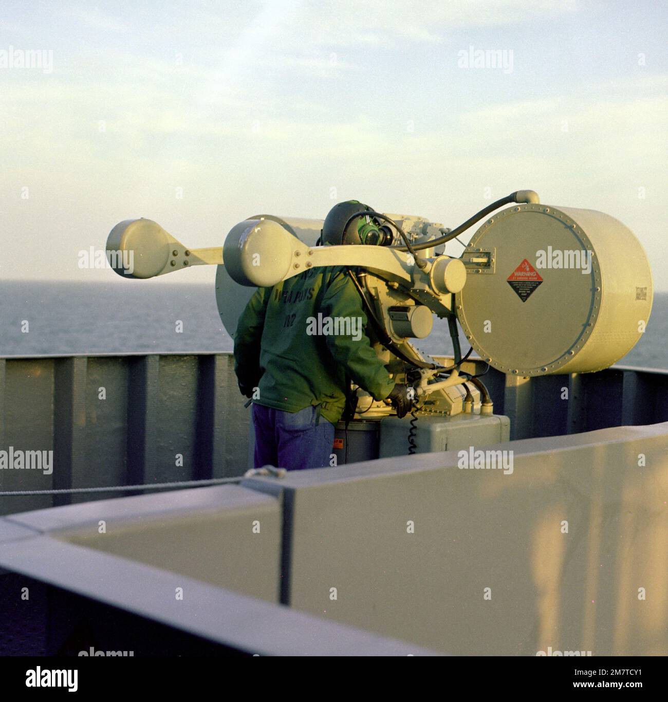 A gunner's mate mans the Mark 115 Sea Sparrow fire control system director during a RIM-7 Sea ...