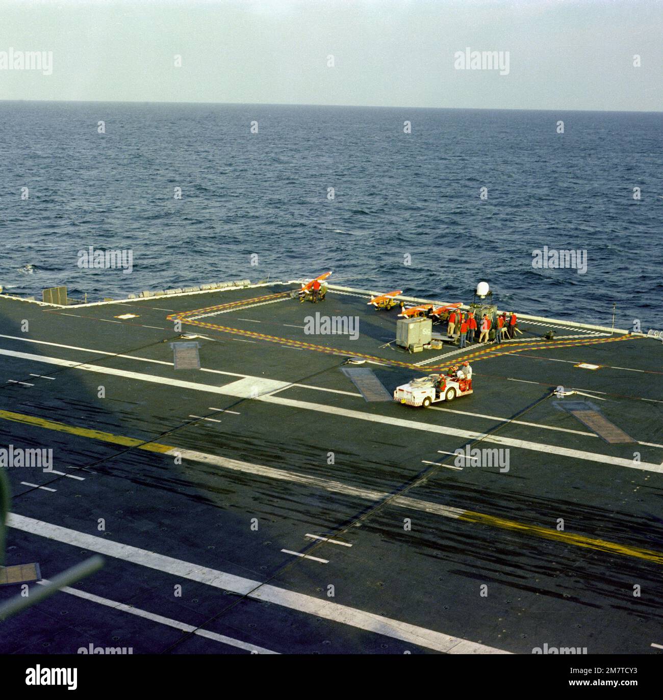 Crew members make final checks on MQM-74C target drones set up for ...