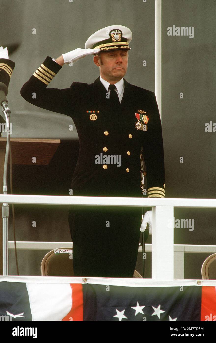 CAPT Arlington F. Campbell, commanding officer (gold crew), salutes ...