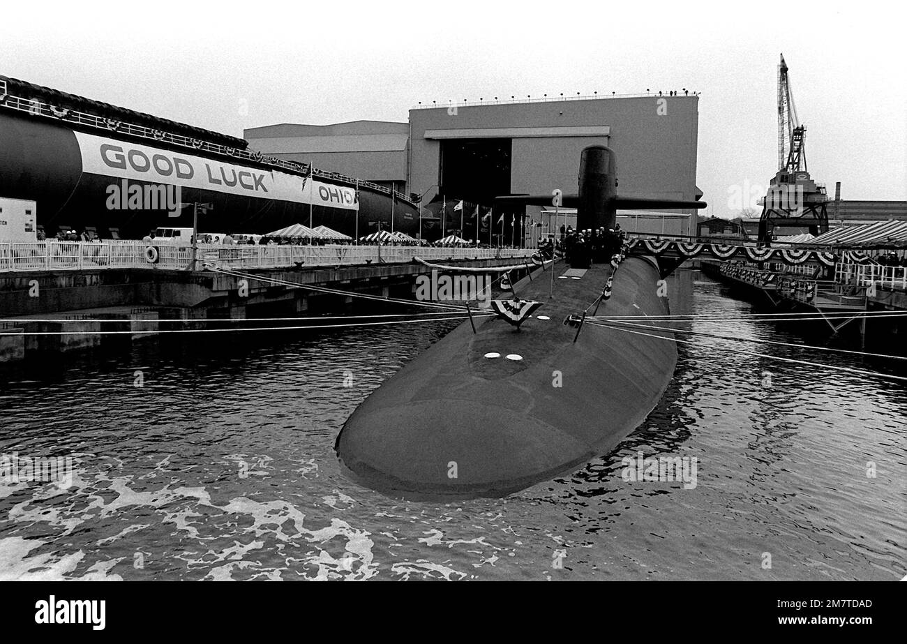 Crewmen stand near the sail of the nuclear-powered ballistic missile ...