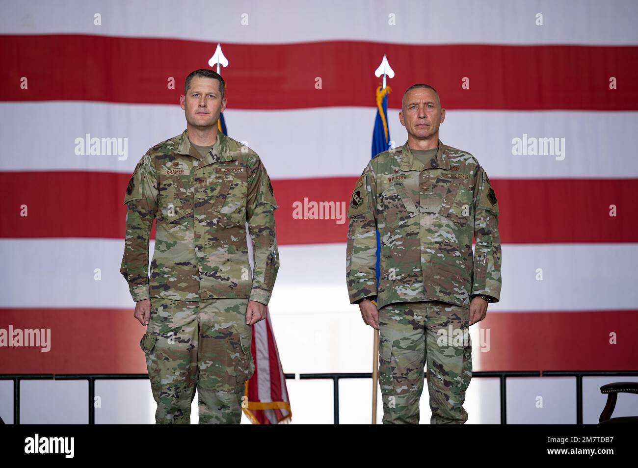 Col. Joseph Kramer, 7th Bomb Wing commander, stands beside Col. Brady ...