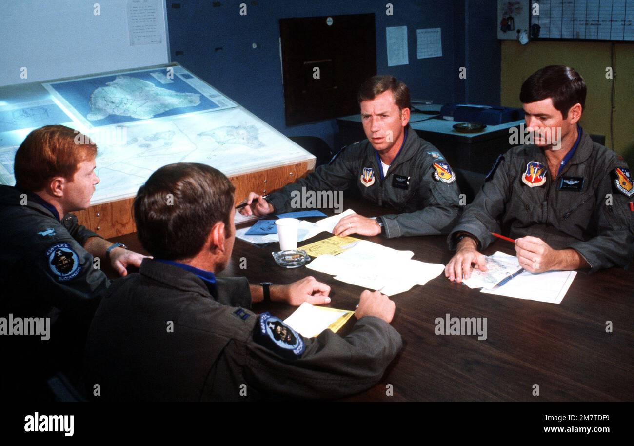 F-16 Fighting Falcon aircraft pilots hold a preflight briefing during ...