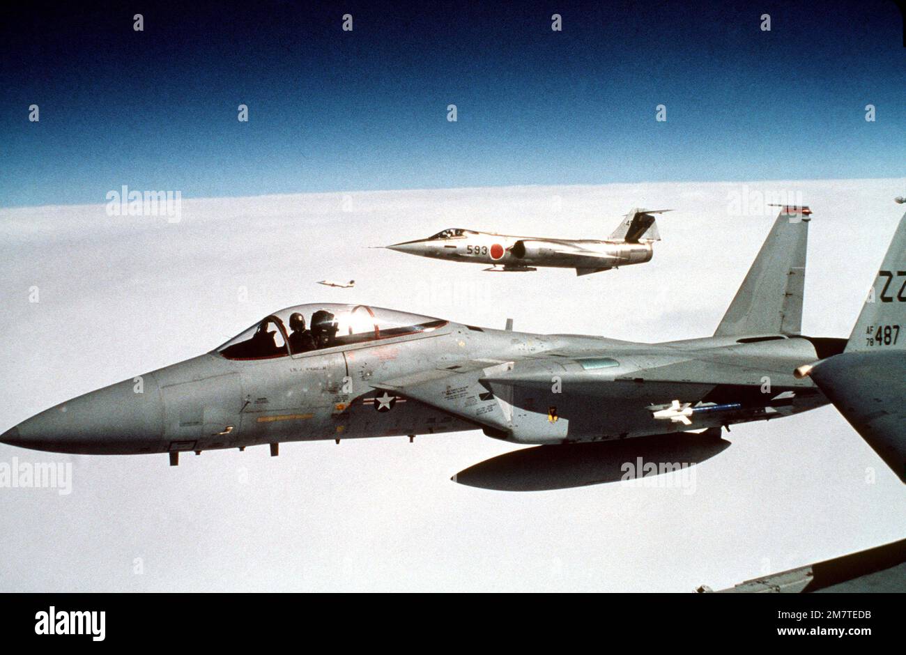 A left side view of an F-15 Eagle aircraft carrying an AIM-9 Sidewinder ...