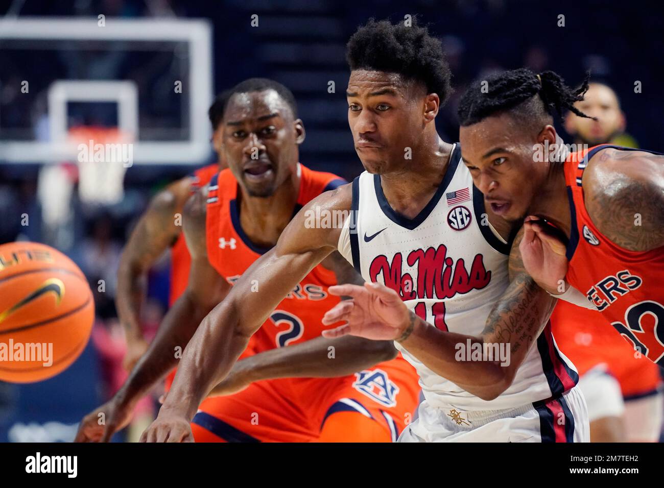 Mississippi guard Matthew Murrell (11) pushes past Auburn guard Allen ...