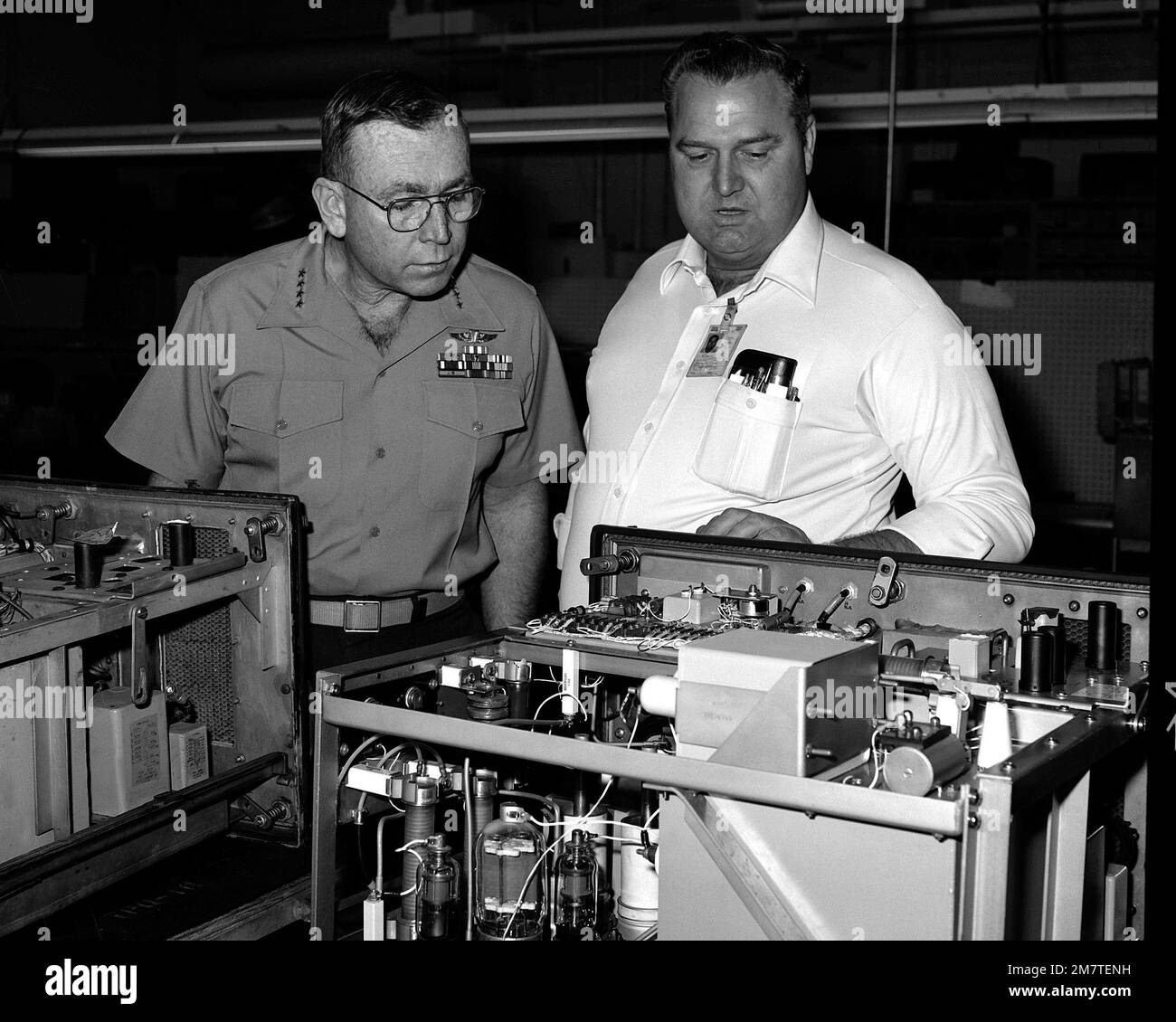 GEN P. X. Kelly, assistant commandant of the Marine Corps, is briefed ...