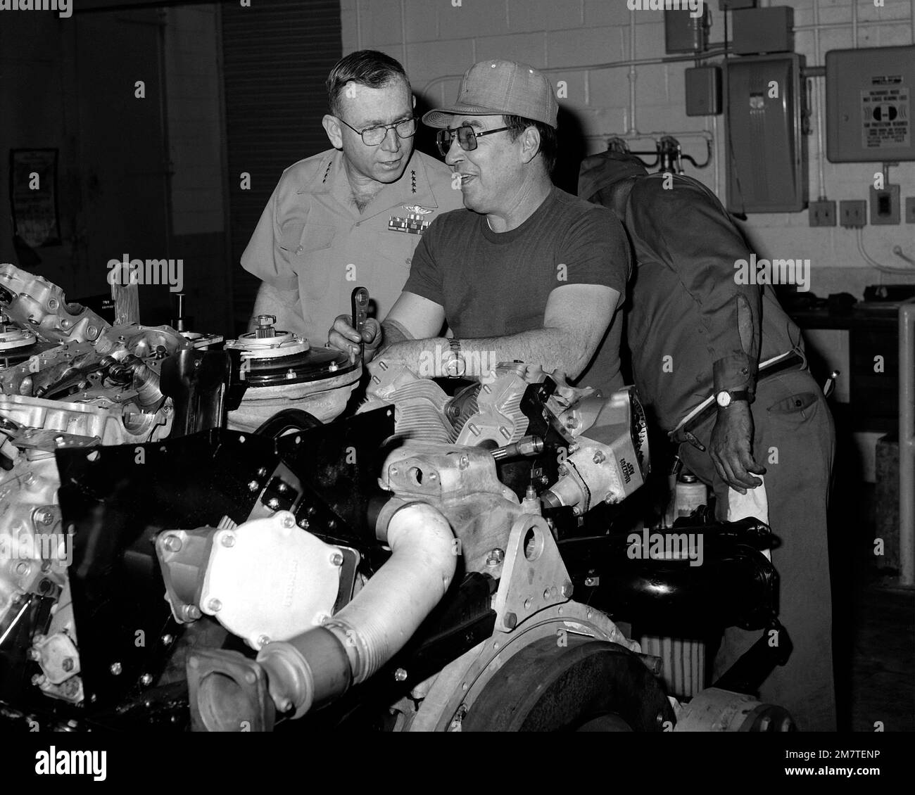 GEN P. X. Kelly, assistant commandant of the Marine Corps, listens ...