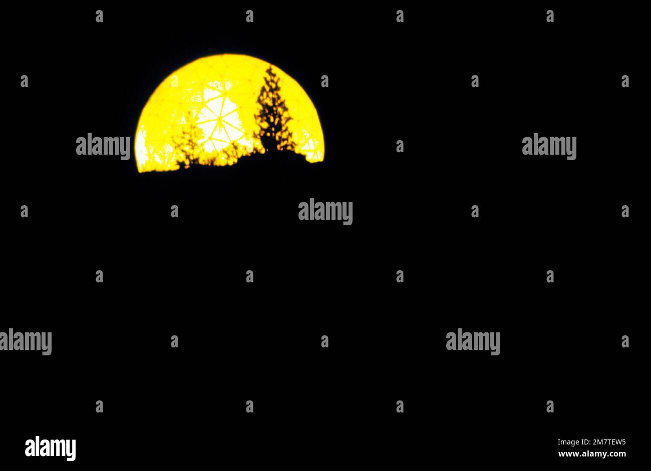 Night view of a Defense Meteorological Satellite Program radar dome ...