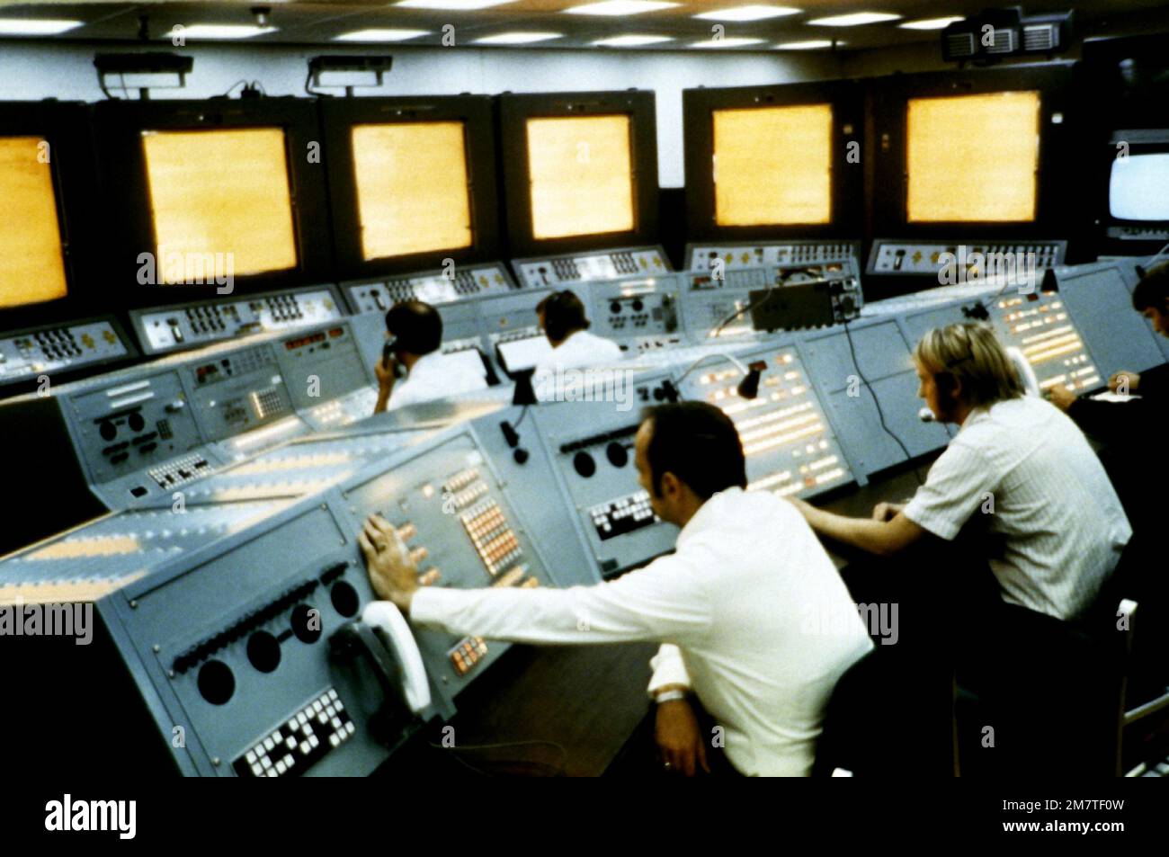 Technicians man their computer consoles in the launch control center of ...