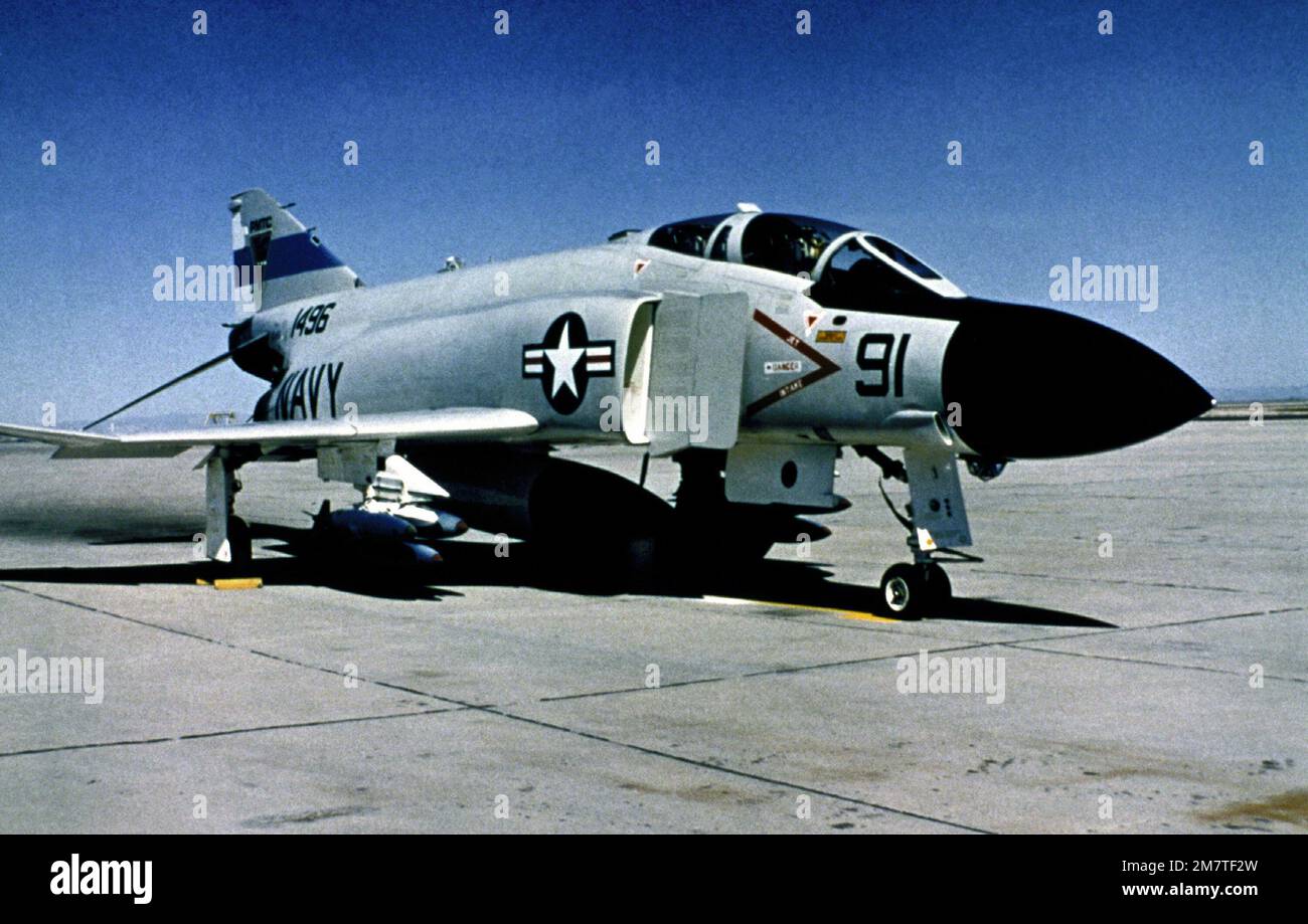 A view of a parked Navy F-4C Phantom II aircraft, armed with practice ...