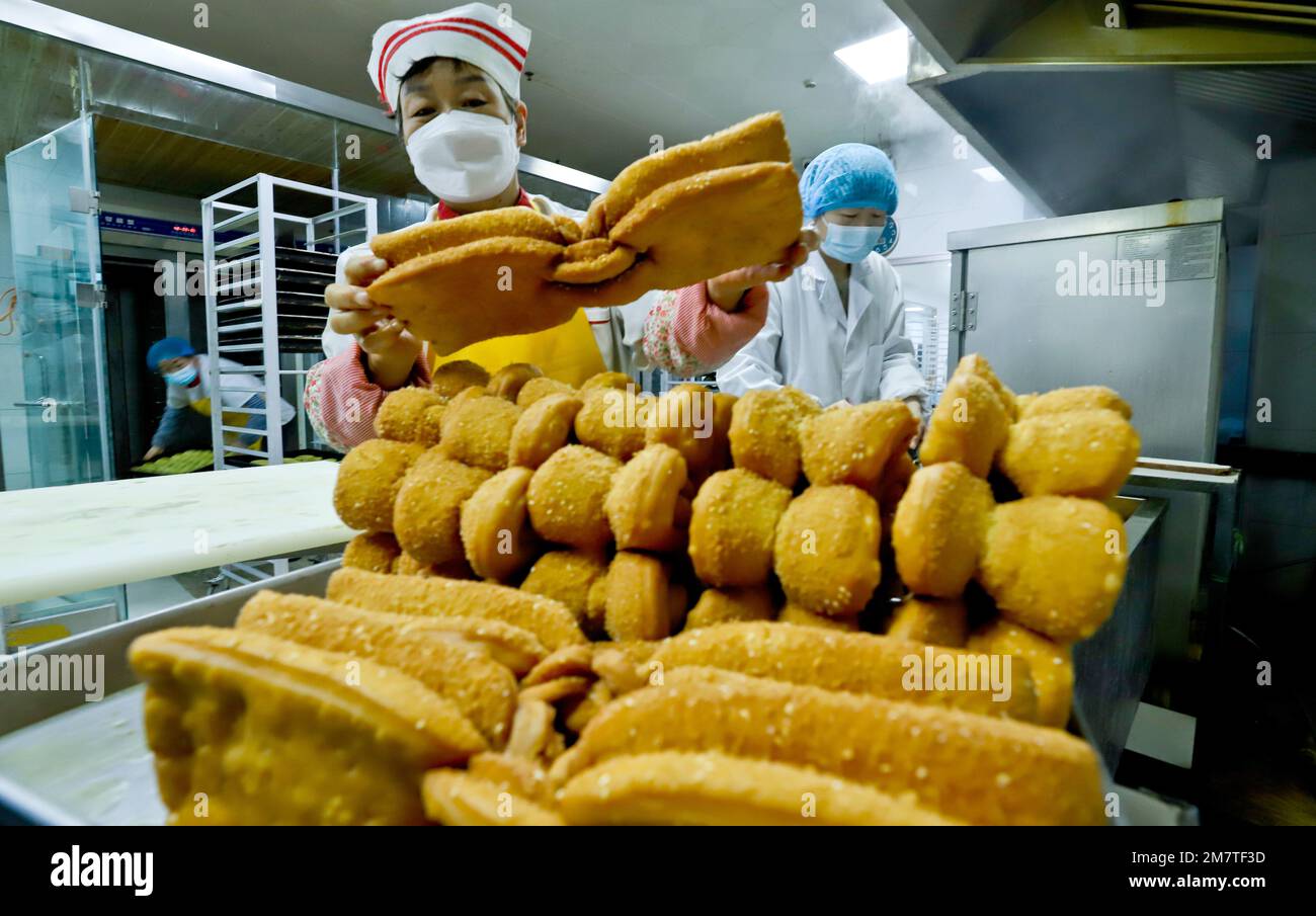 ZHANGYE, CHINA - JANUARY 10, 2023 - A worker makes "sugar huagzi" at ...