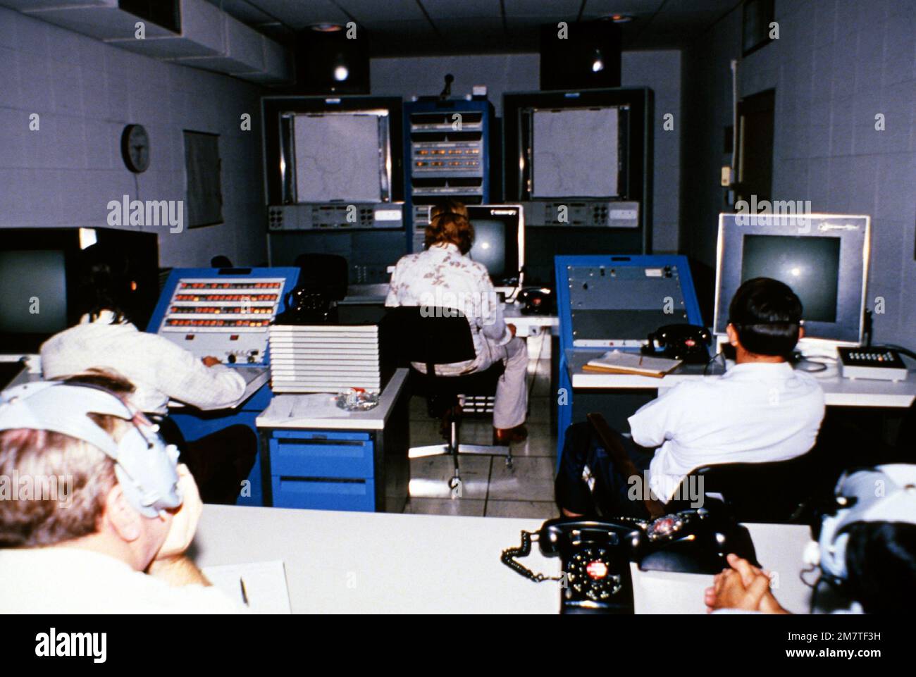 Technicians man their test consoles in the Global Positioning System ...