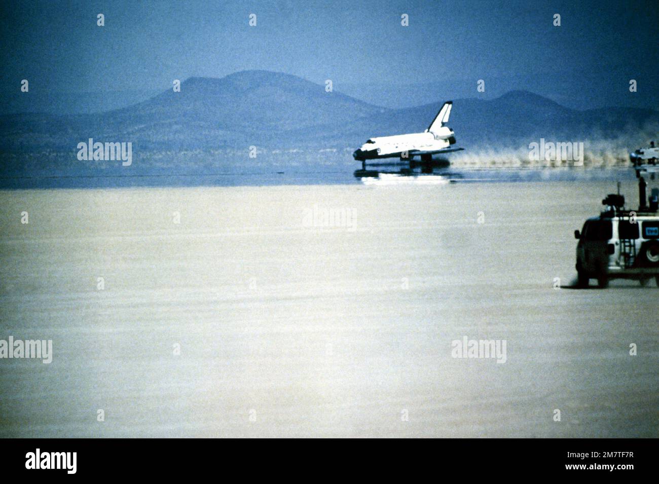 A front view of the Columbia space shuttle orbiter landing. Base ...