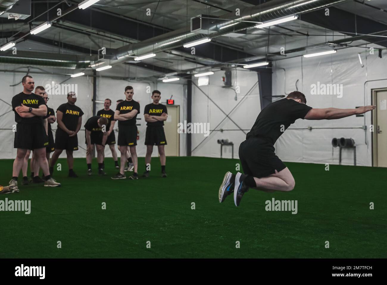 Alaska Army National Guardsmen compete in the Knee Jump, a mystery ...