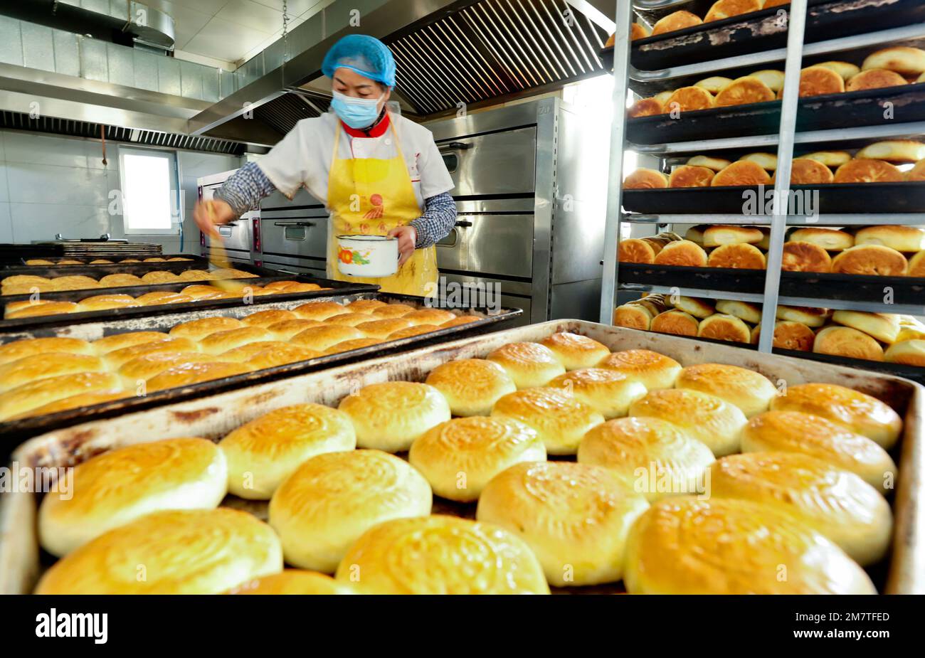 ZHANGYE, CHINA - JANUARY 10, 2023 - A worker makes "sugar huagzi" at ...