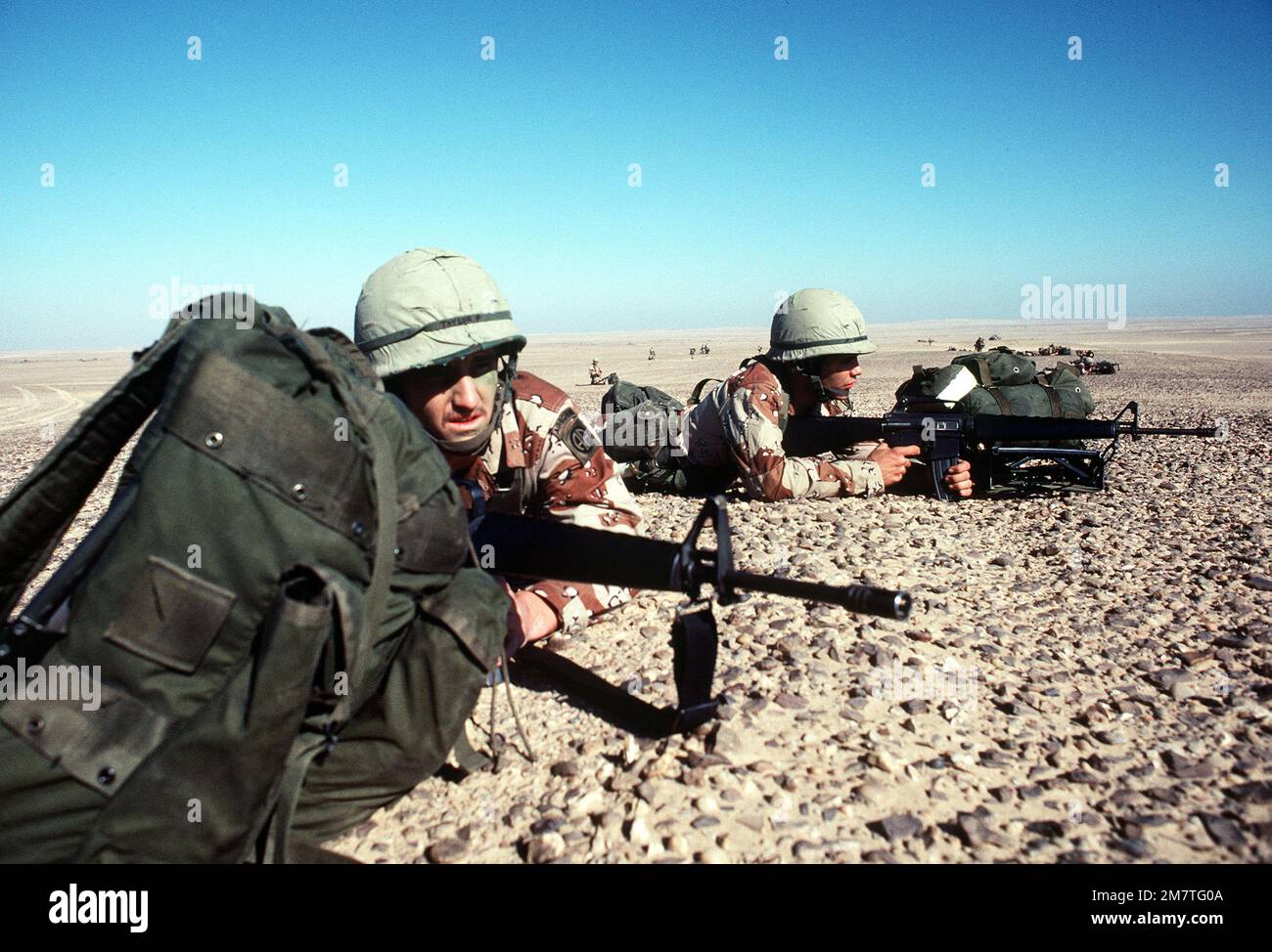 Members of the 82nd Airborne Division, armed with M-16A1 rifles, take ...