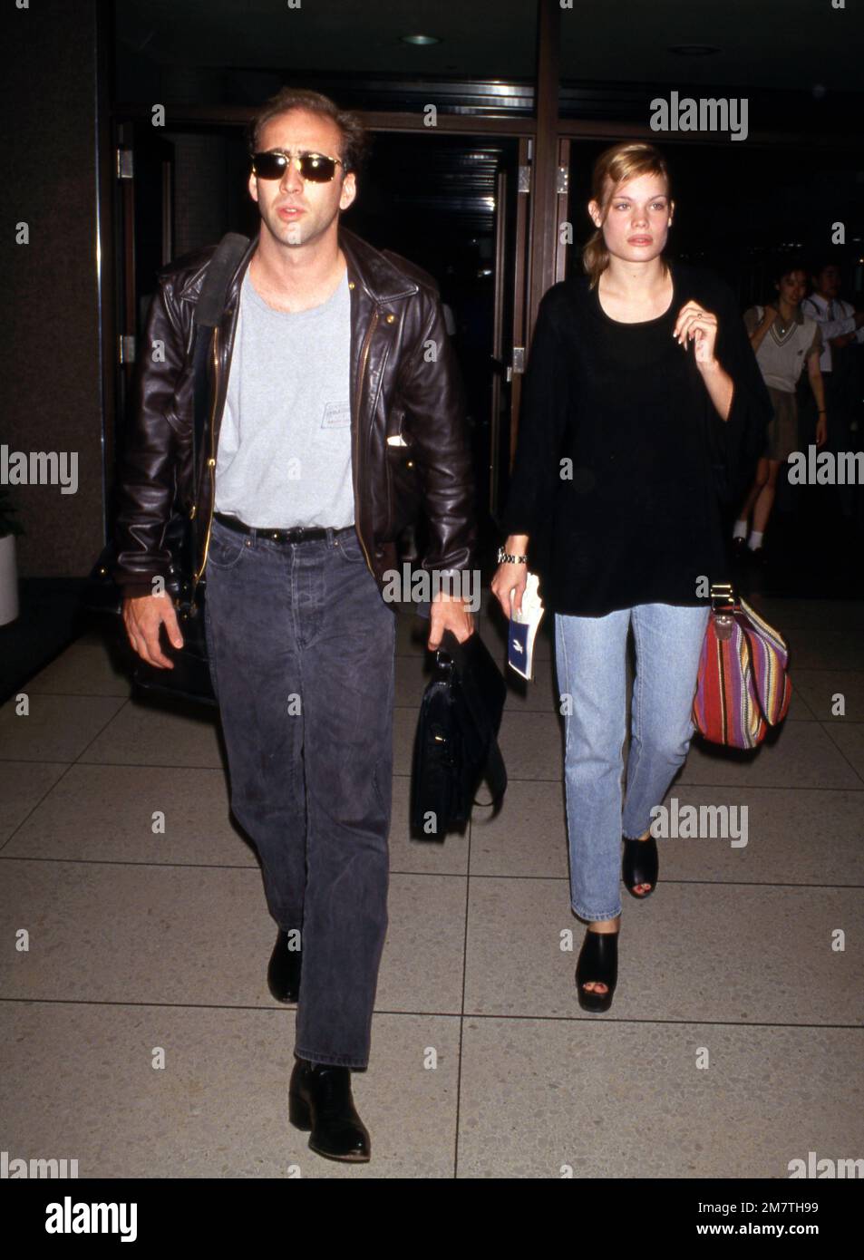 Nicolas Cage and girlfriend Kristen Zang on July 28, 1993 arrive at the ...
