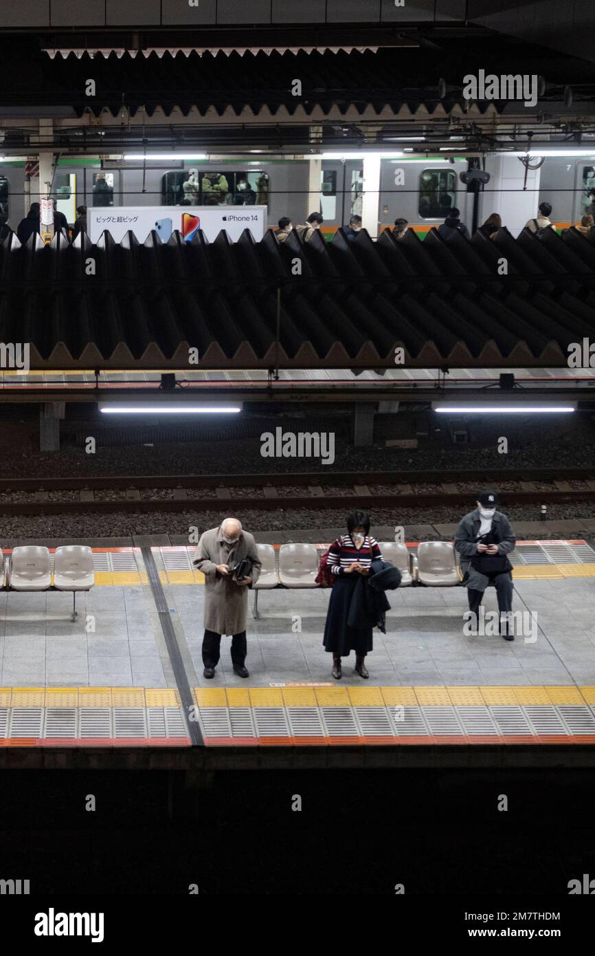 Tokyo, Japan. 6th Jan, 2023. Commuters wait on a platform at Shinjuku ...