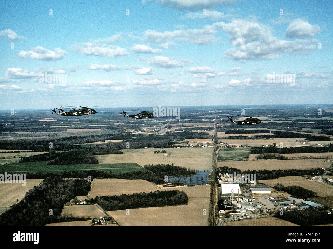 Air-to-air right side view of four RH-53D Sea Stallion helicopters ...