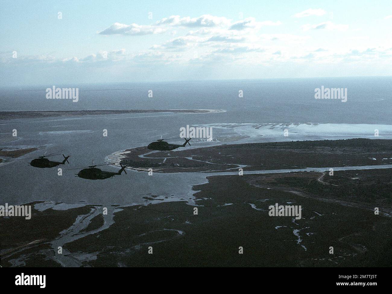 Left side view of three in-flight RH-53D Sea Stallion helicopters as ...