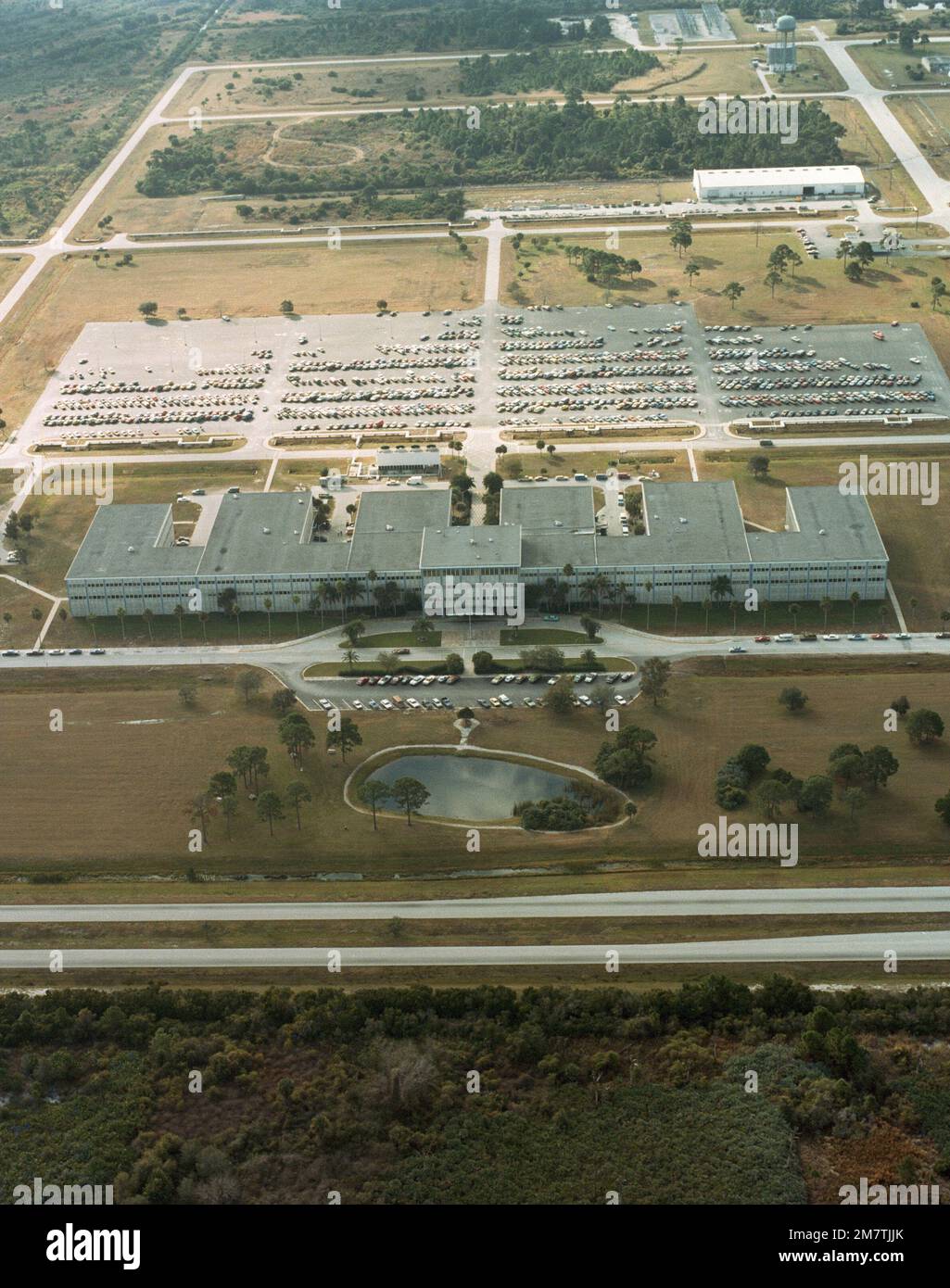 An aerial view of the Headquarters Building. Base: Kennedy Space Center ...