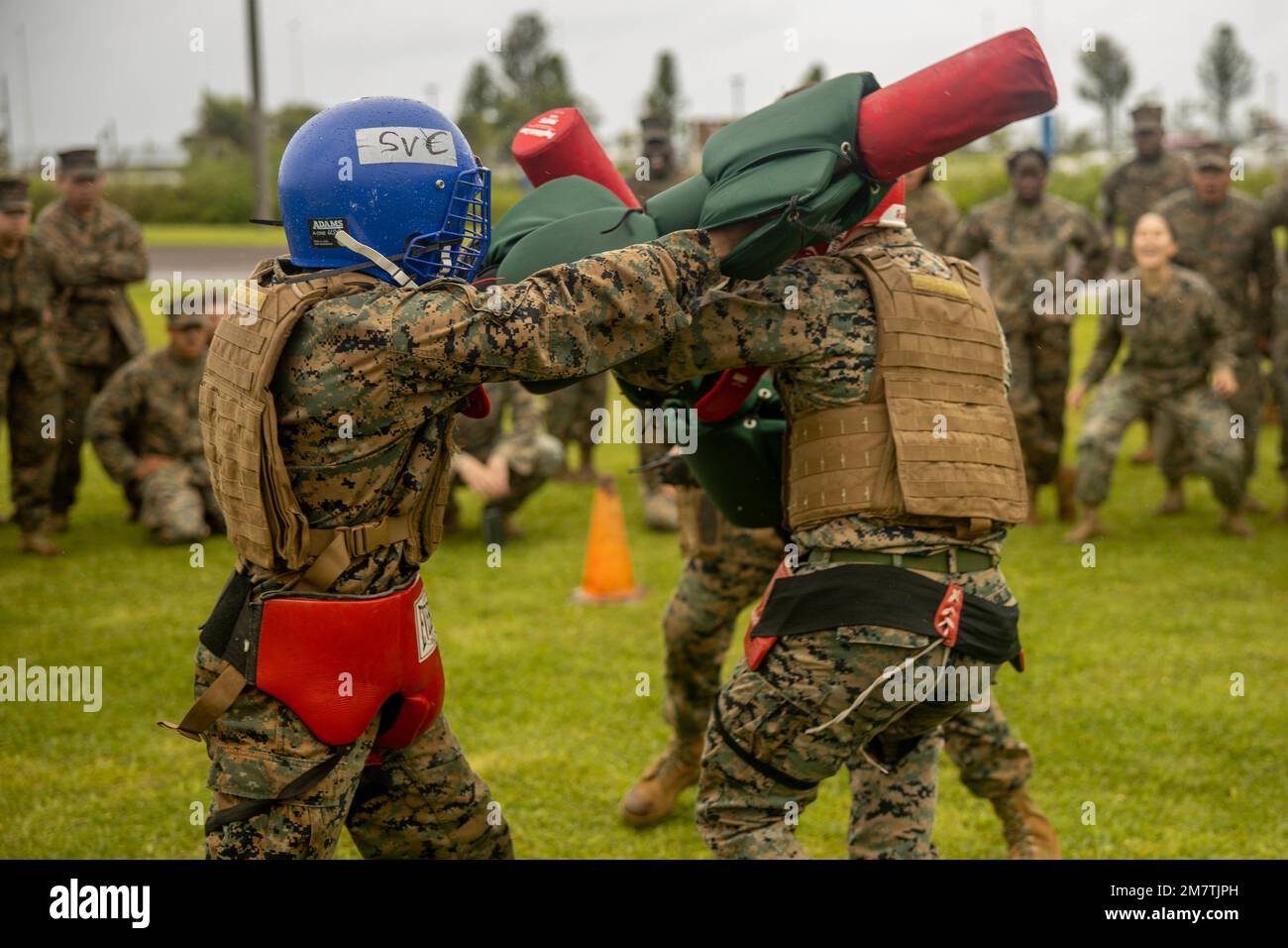 U.S. Marines with Combat Logistics Regiment 37, 3rd Marine Logistics Group, compete in a pugil ...