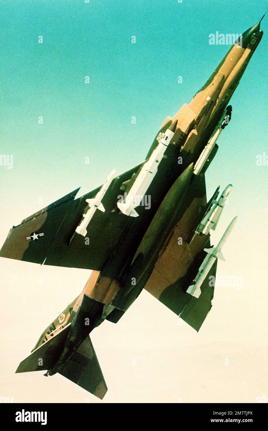 An air-to-air view of the underside of an F-4G Phantom II aircraft ...