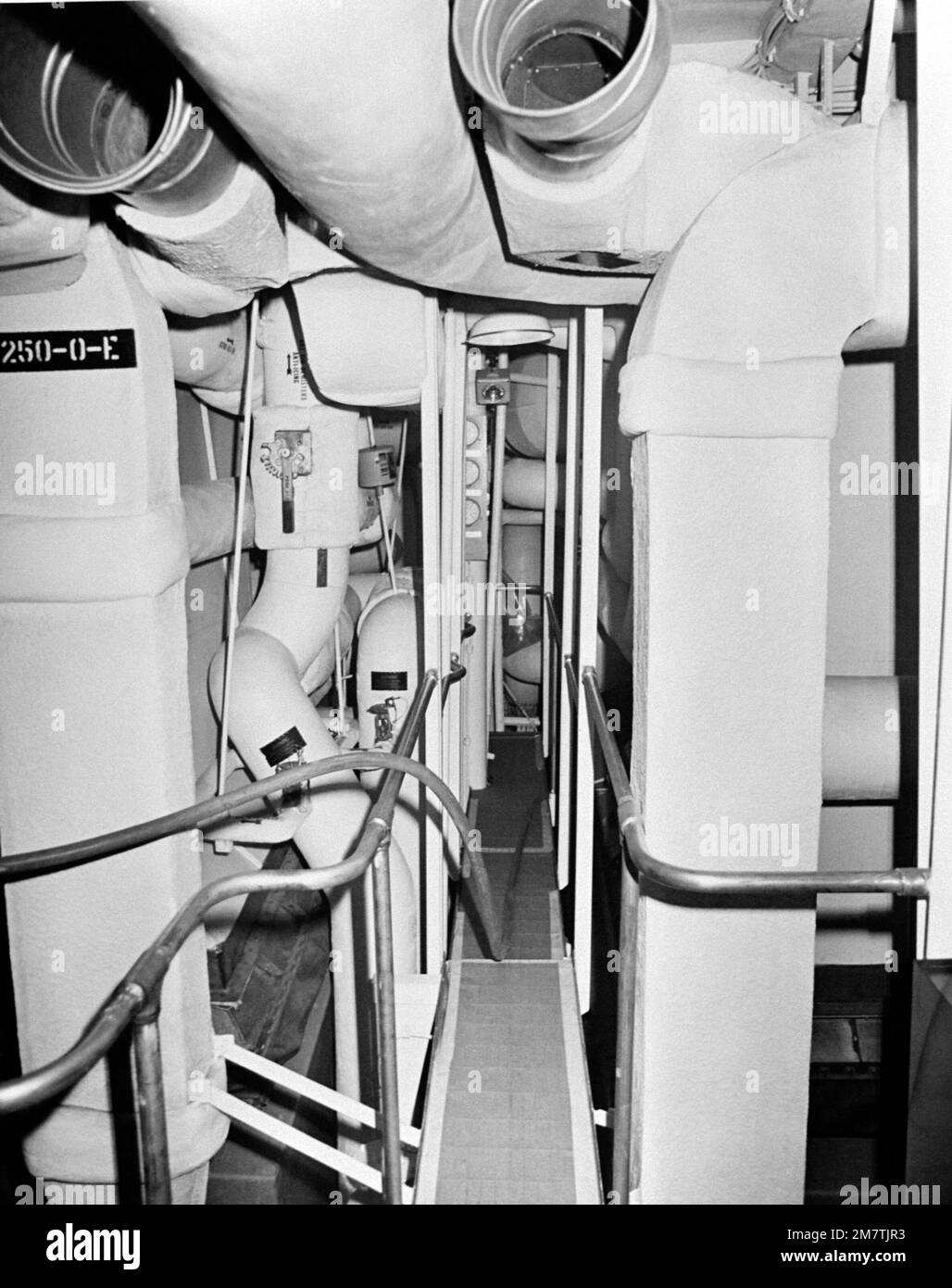 An interior view of the engine room on the guided missile frigate USS ...