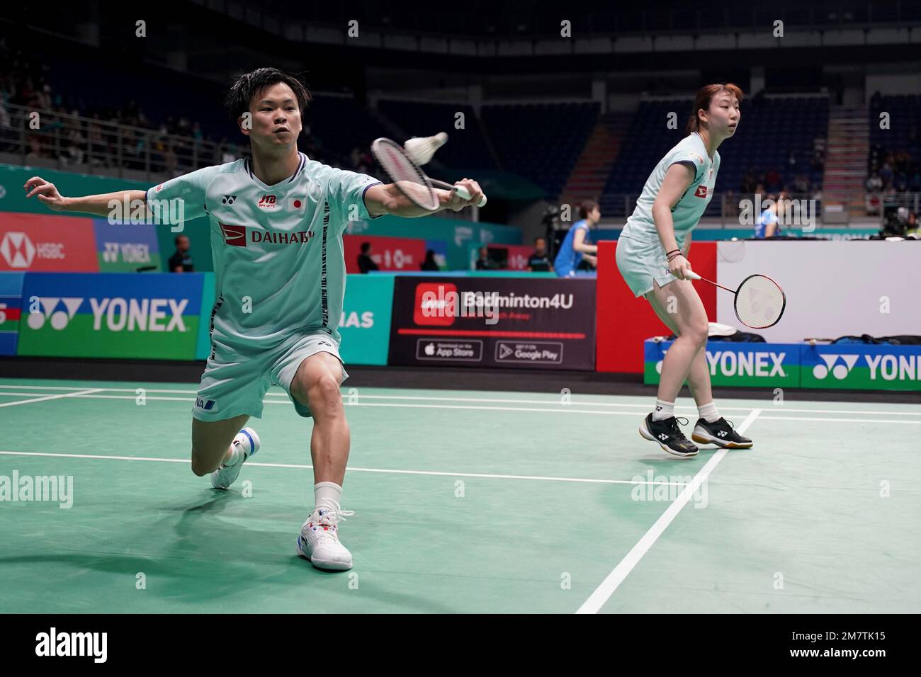 Japan's Yuta Watanabe, left, and Arisa Higashino plays a shot against ...