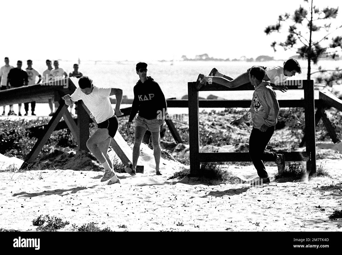 Two class officers at Aviation Officer Candidate School encourage a ...