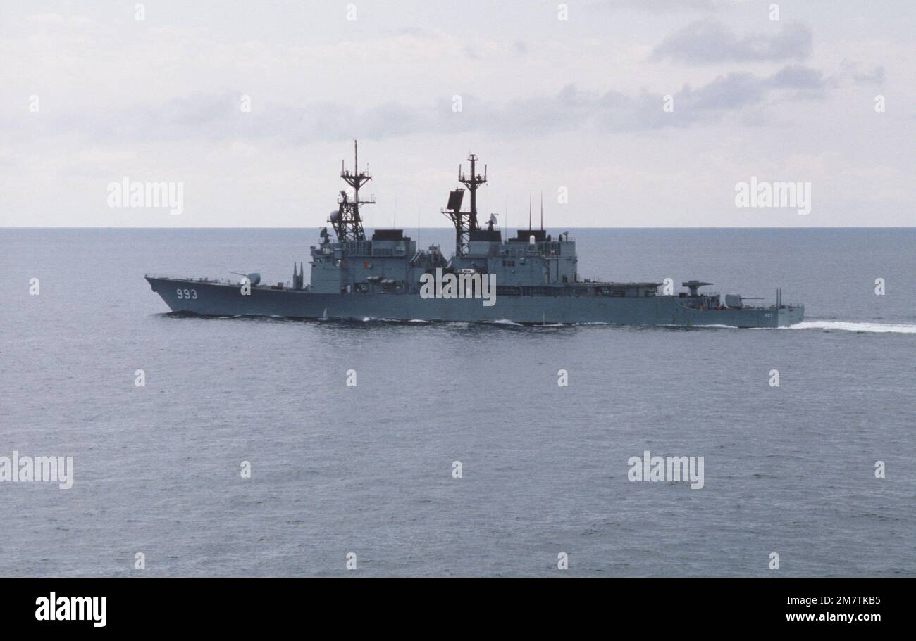 A port side view of the guided missile destroyer USS KIDD (DDG 993) underway. Country ...