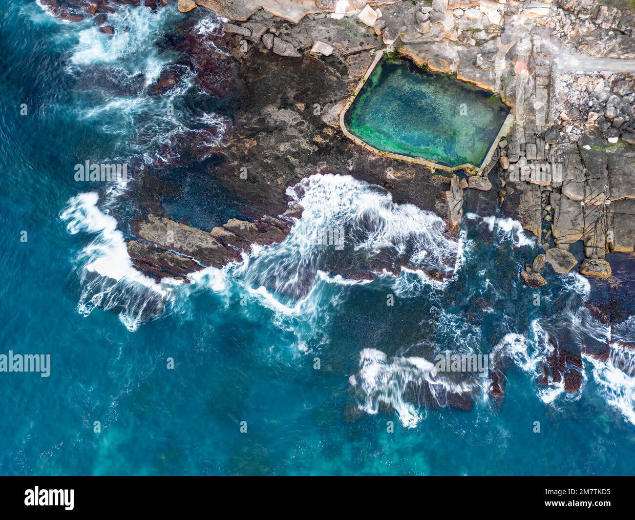 Tidal swimming pool built into the rocky cliffs of the coastline ...