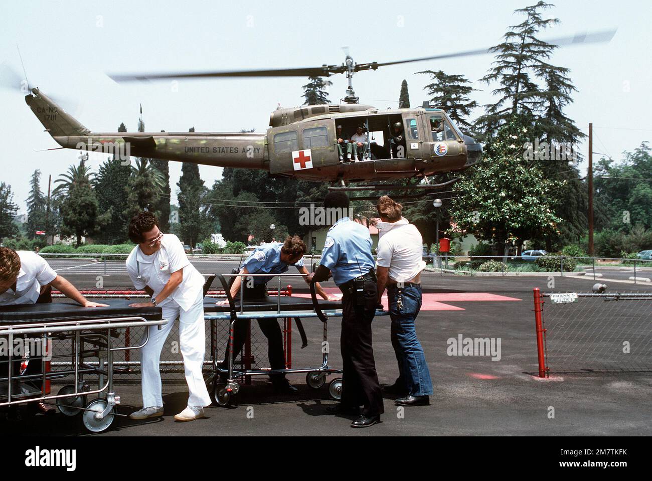 An Army UH-1 Iroquois helicopter takes off to transport "casualties" to ...
