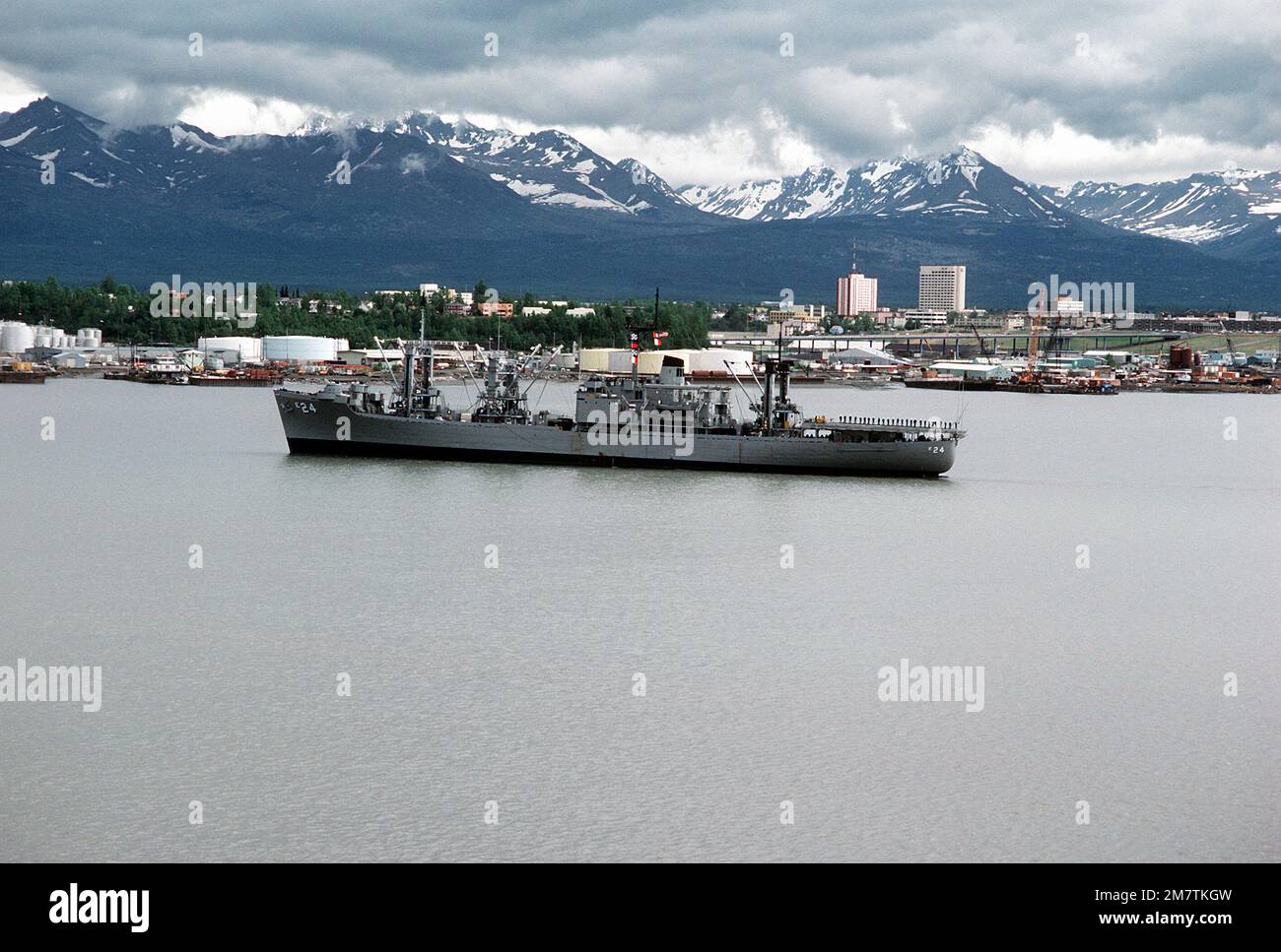 A port beam view of ammunition ship USS PYRO (AE-24) as it enters port ...