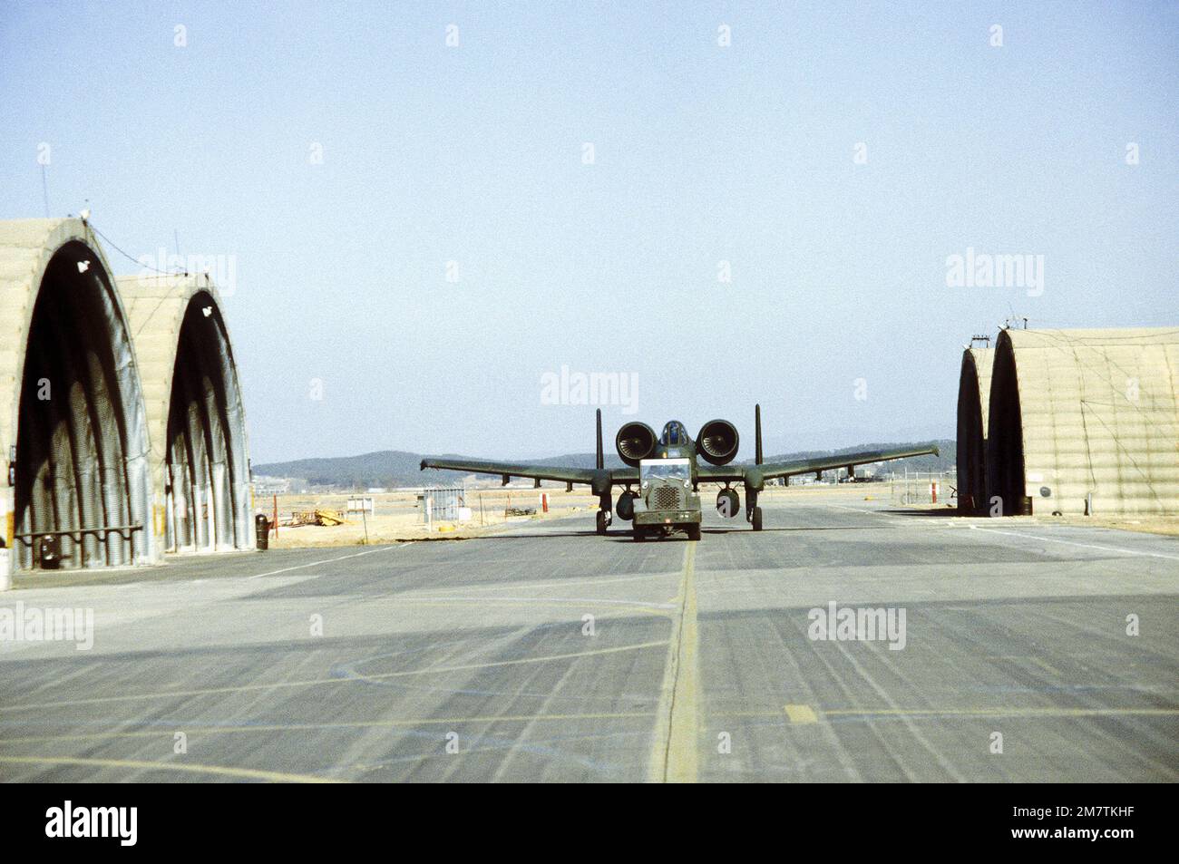 Front view of an A-10 Thunderbolt II aircraft being towed into its ...