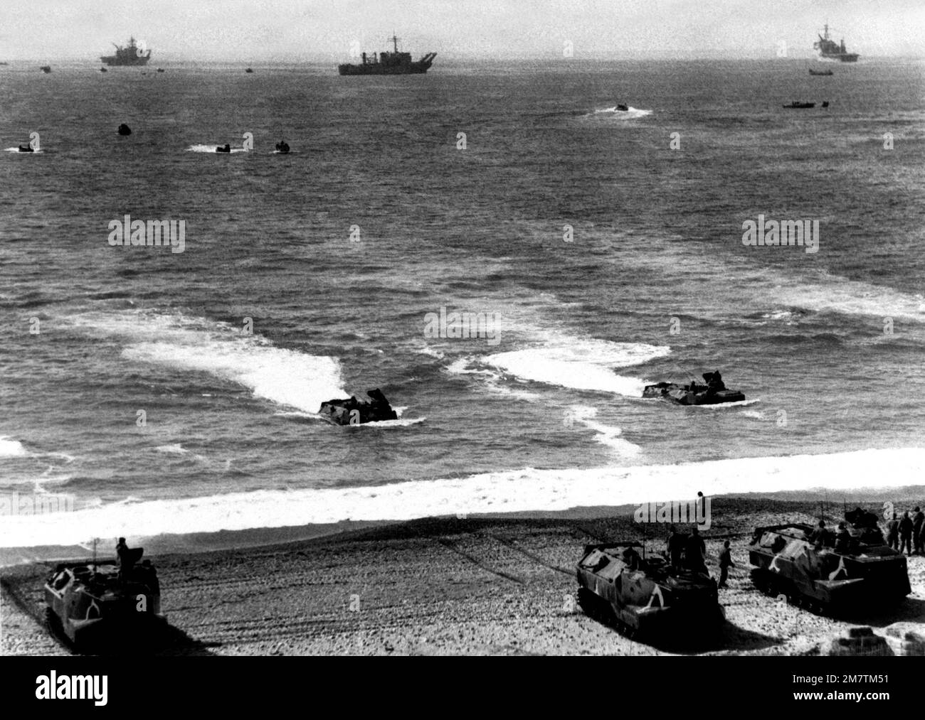 U.S. Marine Corps tracked landing vehicle (LVTP-7) come ashore during ...