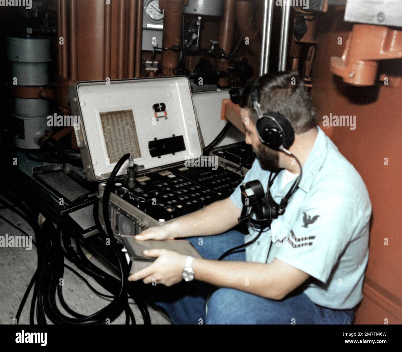 A petty officer, second class, monitors equipment in the missile ...