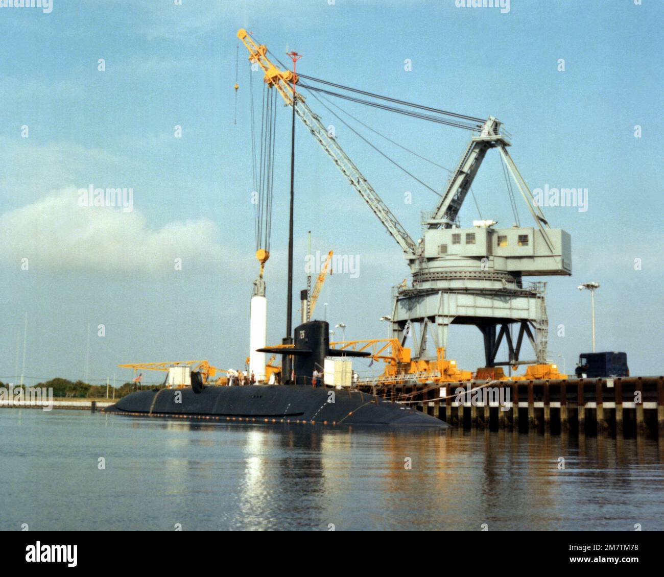A C-4 Trident I missile is loaded aboard the nuclear-powered strategic ...